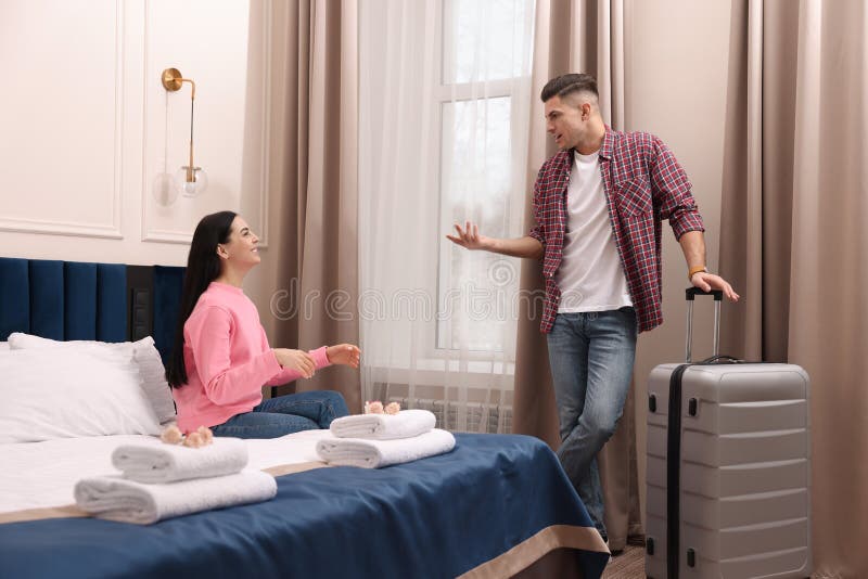 Happy Couple Having Conversation in Hotel Room Stock Photo - Image of ...
