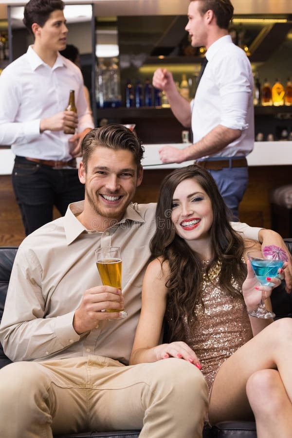 Happy Couple Having a Drink Together Stock Photo - Image of four, stylish: 45701418