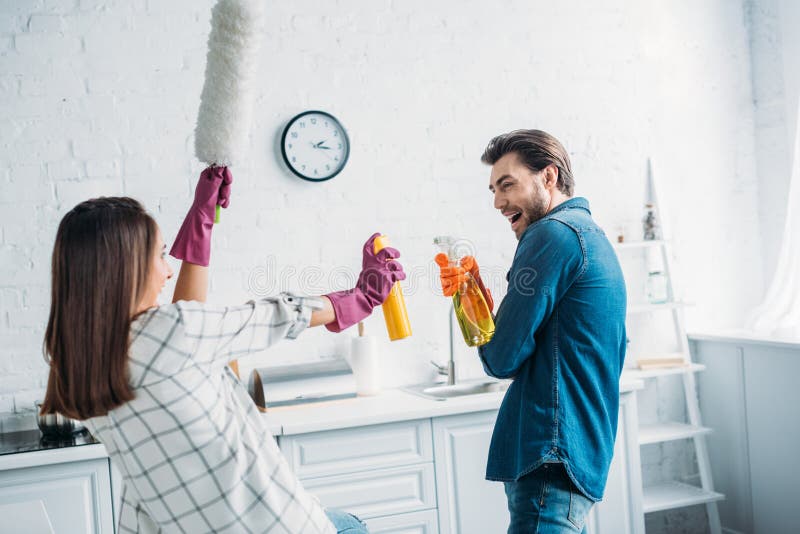 Happy Couple Having Fun during Cleaning Kitchen and Fighting Stock ...