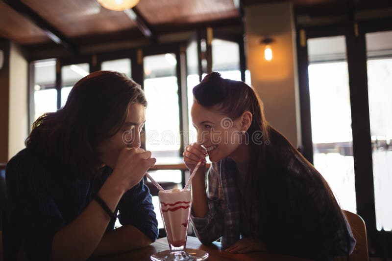Happy Couple Having Milkshake Stock Image - Image of female, closeness ...