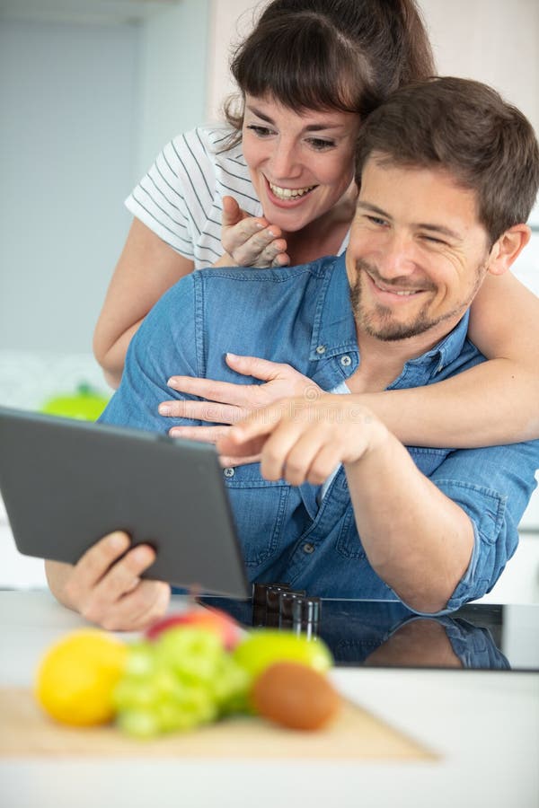 Happy Couple in Home Kitchen Using Electronic Tablet Stock Image - Image of portrait, choosing ...