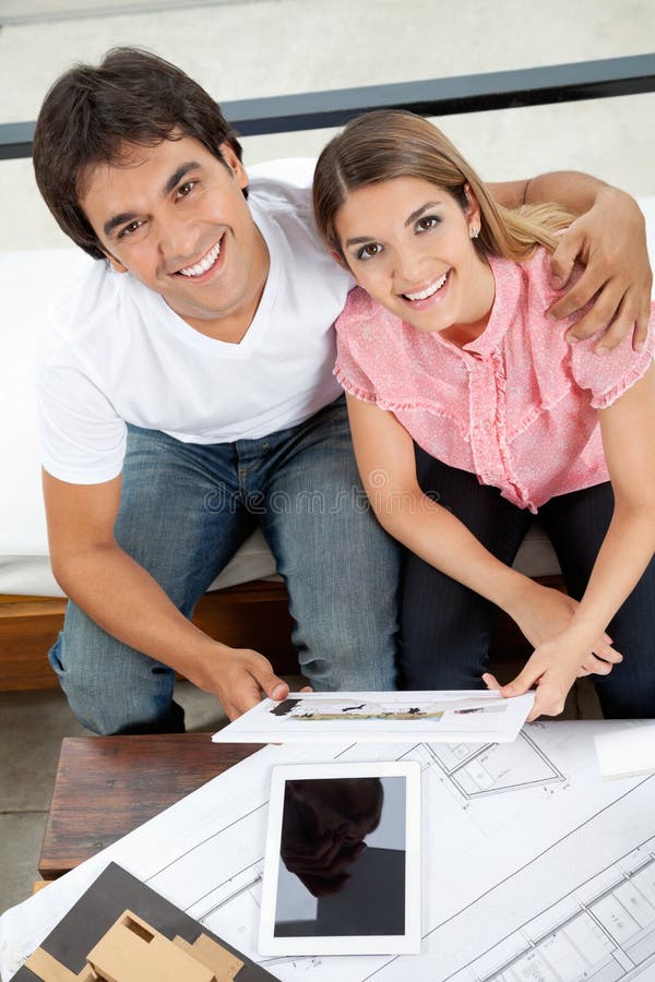 Happy Couple with House Plan Stock Image - Image of digital, caucasian ...