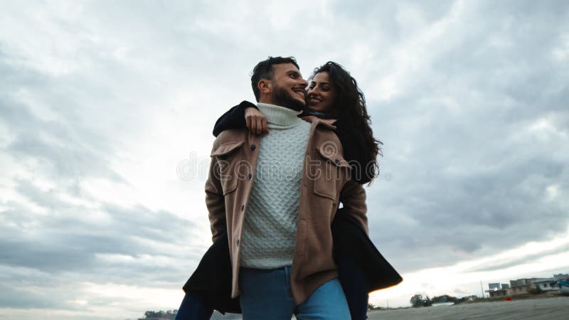 Happy Couple Hug on the Beach in Cloudy Valentines Day Stock Image ...