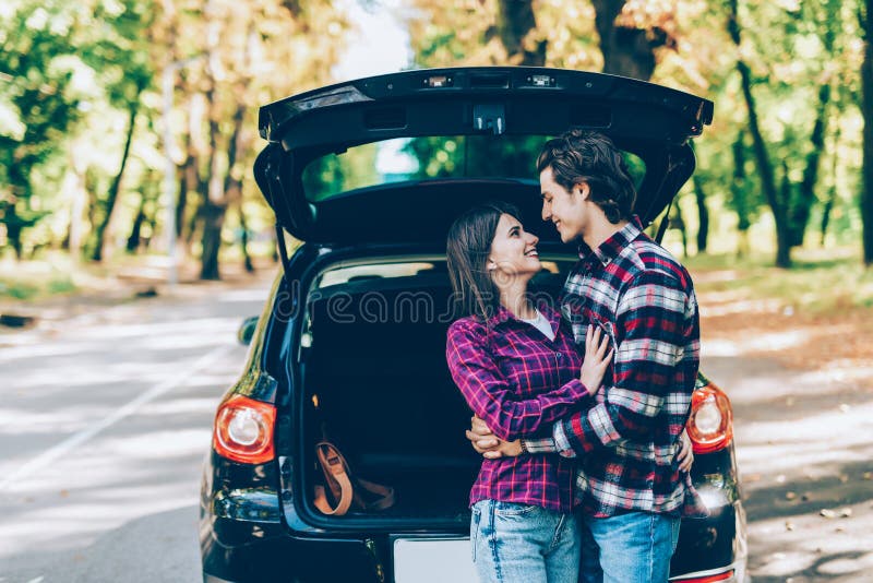 Young Happy Couple Hug on Trunk of Hatchback Car Outdoors Stock Image ...