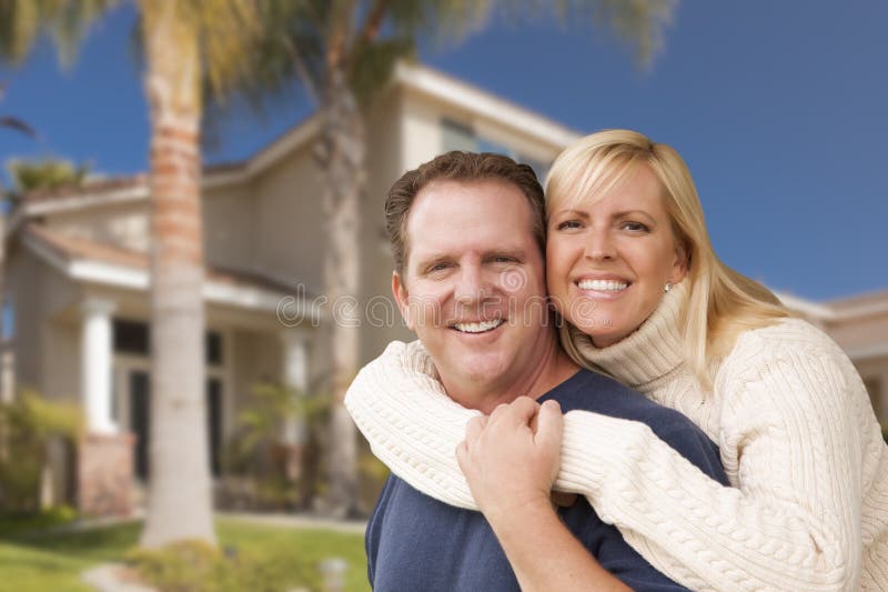 Happy Couple Hugging in Front of House Stock Image - Image of adult ...