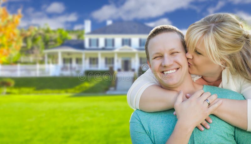 Happy Couple Hugging in Front of House Stock Photo - Image of lady ...