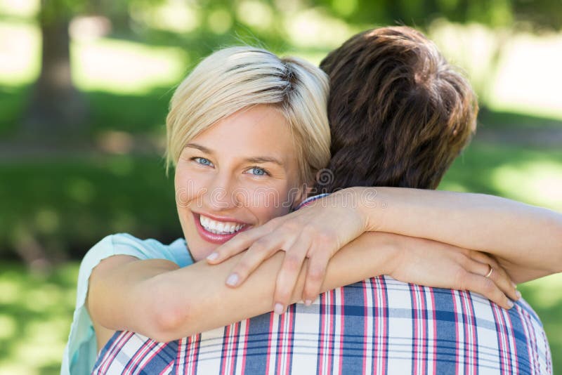 Happy Couple Hugging at the Park Stock Photo - Image of adult, portrait ...