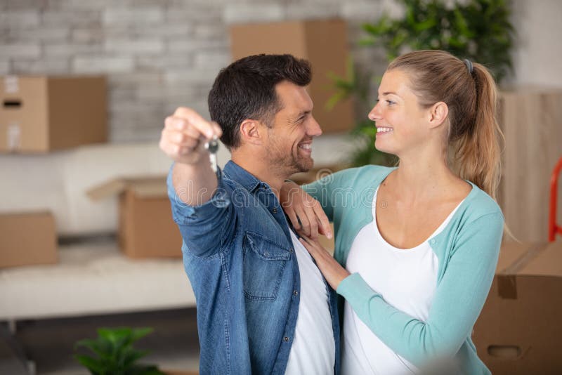 Happy Couple with Key from Their New House Stock Image - Image of ...