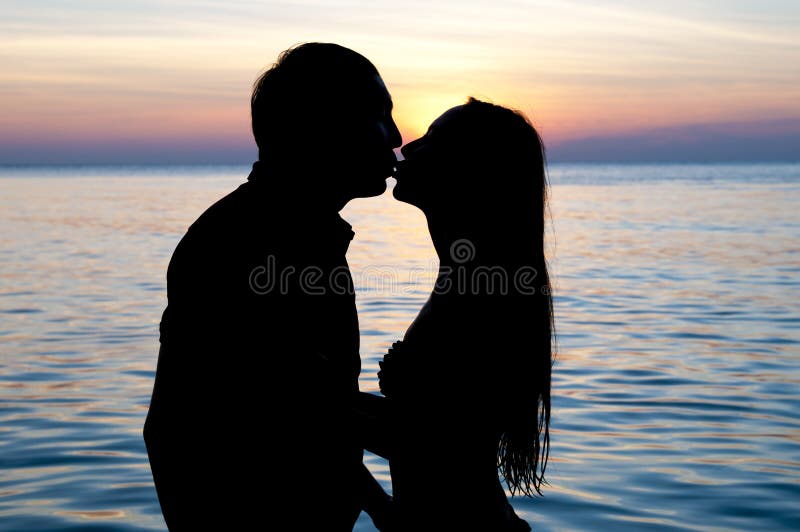Happy couple kiss on beach stock photo. Image of white - 18533400