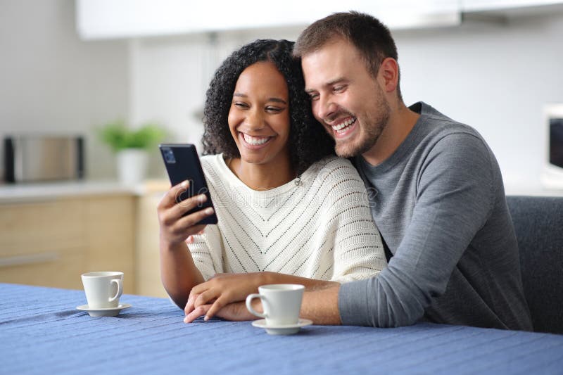 Happy Man Checking Phone Under an Umbrella in Winter Stock Image ...