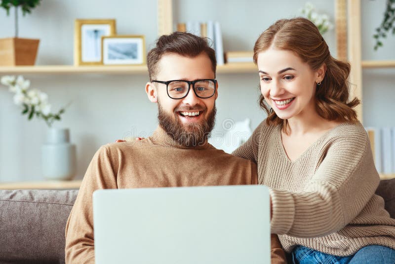Happy Couple with Laptop Computer at Home Stock Photo - Image of ...