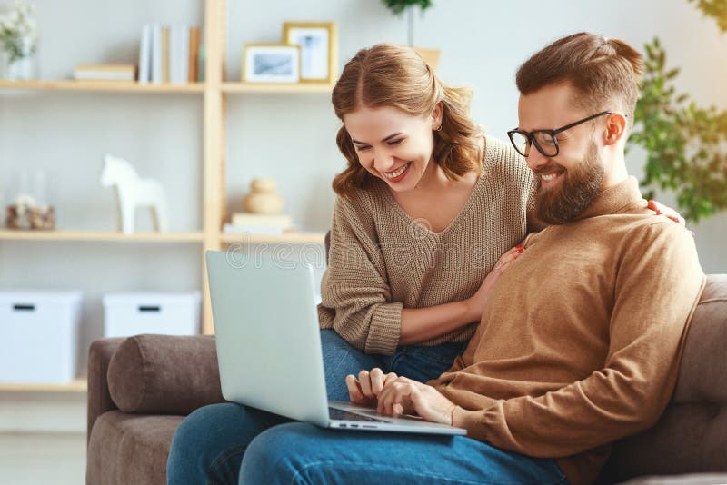 Happy Couple with Laptop Computer at Home Stock Photo - Image of male ...