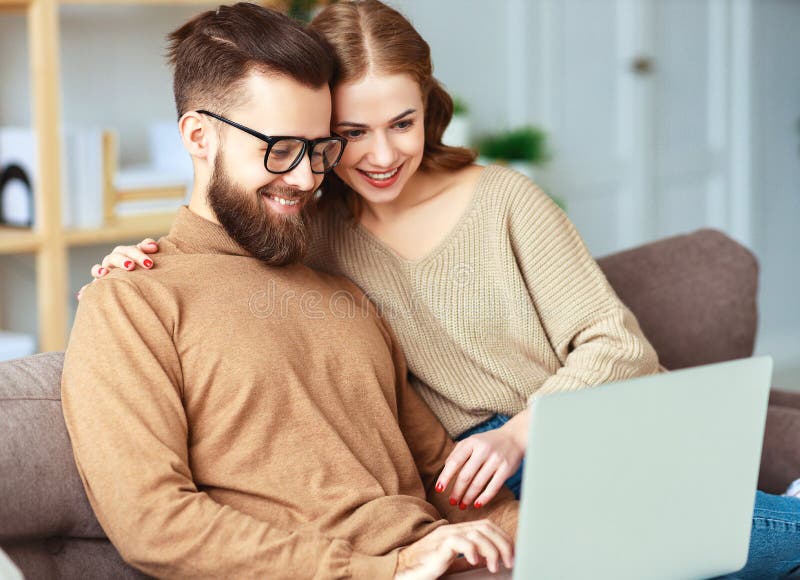 Happy Couple with Laptop Computer at Home Stock Photo - Image of couch ...