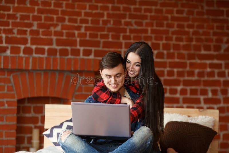 Happy Couple with Laptop Spending Time Together at Home, Browsing ...