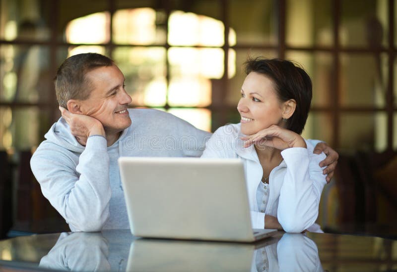 Happy couple with laptop stock photo. Image of finger - 52617798