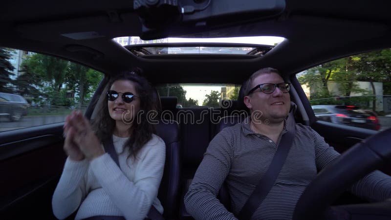 Couple Laughing and Cuddling in Car Driving Stock Footage - Video of ...