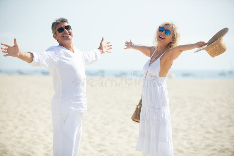 Happy Couple Laughing Together at Beach Stock Photo - Image of ...