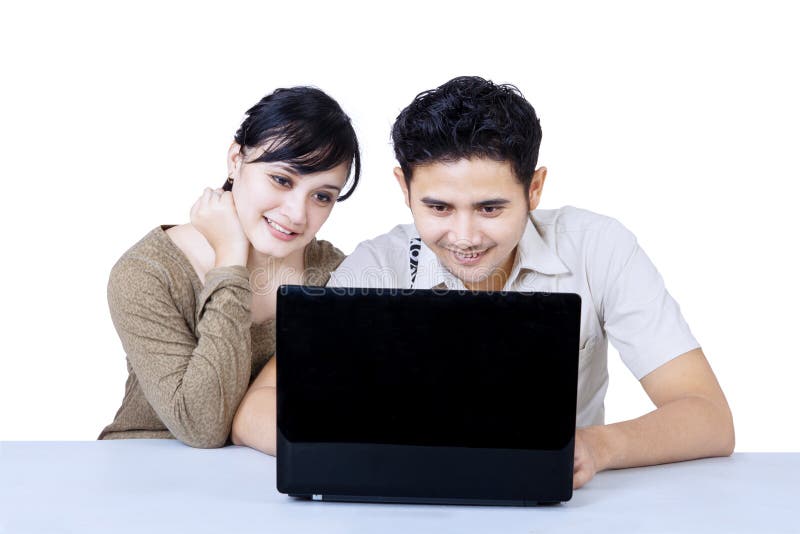 Couple using Laptop stock image. Image of notebook, internet - 771821