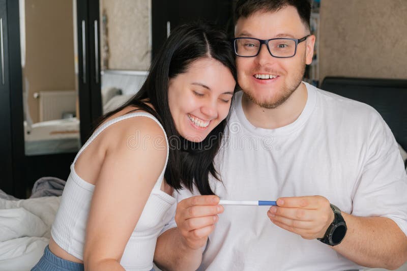 Happy Couple Looking at Positive Pregnancy Test Stock Image - Image of ...
