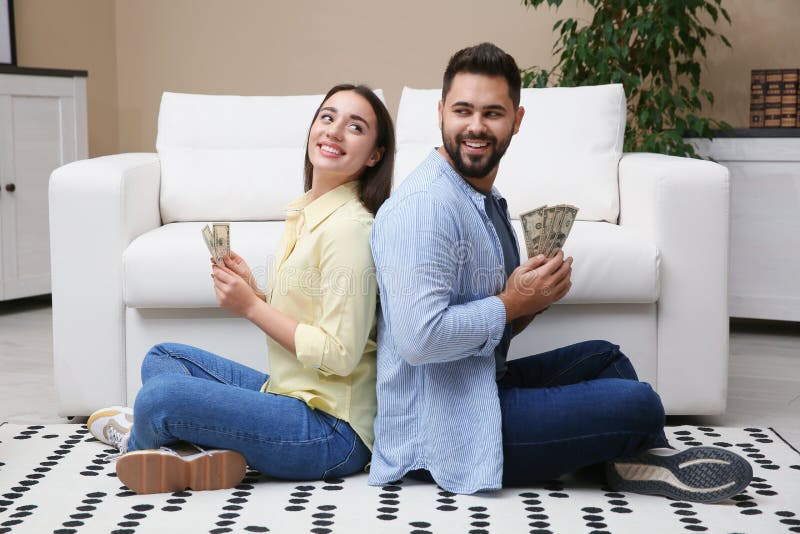 Happy Couple with Money on Floor at Home Stock Photo - Image of ...