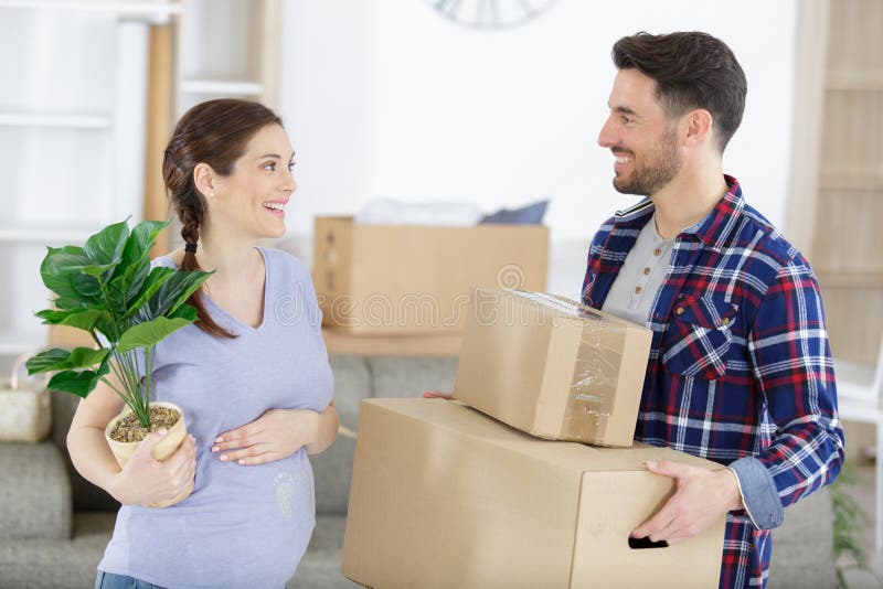 Happy couple moving home stock image. Image of indoor - 253358147