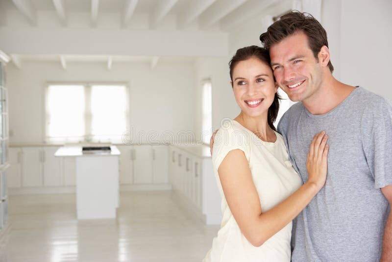 Happy couple in new home stock photo. Image of enjoying - 21045438