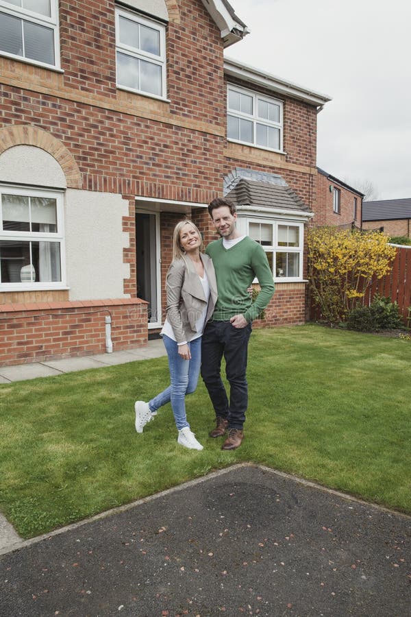 Happy Couple with New Home stock image. Image of care - 98850929