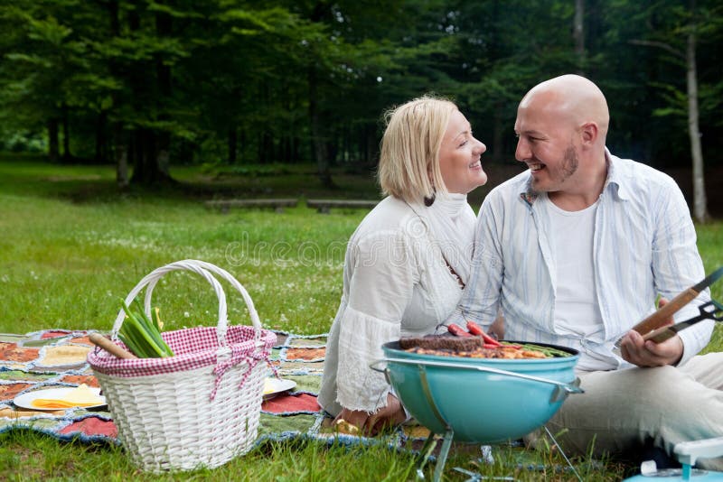 Happy Couple in Park with Barbecue Stock Image - Image of female ...