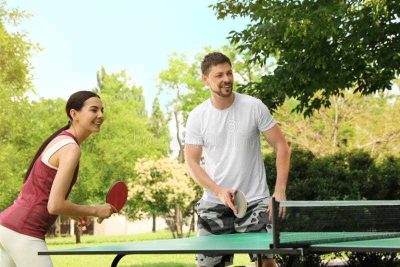 Happy Couple Playing Ping Pong in Park Stock Photo - Image of game ...
