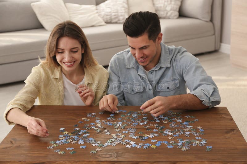 Happy Couple Playing with Puzzles at Home Stock Image - Image of jigsaw ...