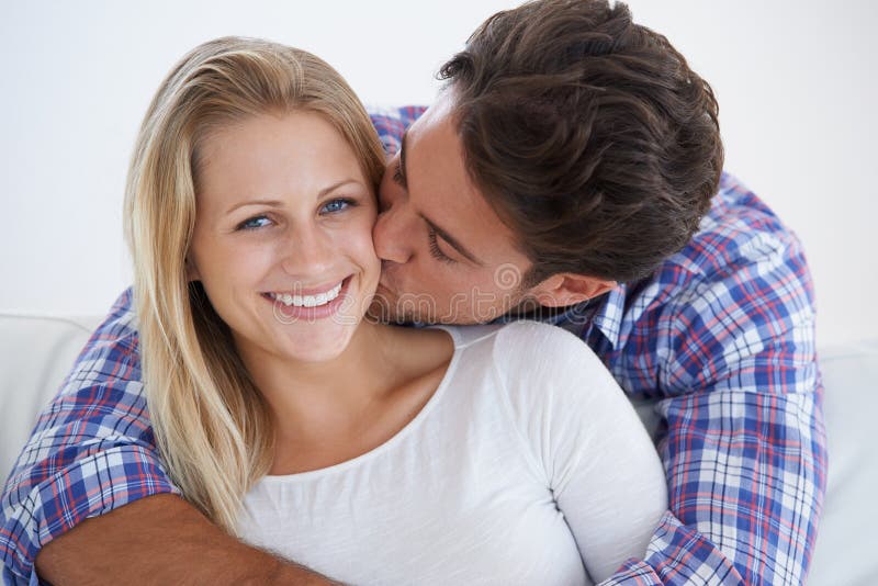 Happy Couple Portrait And Kissing With Hug Marriage And Embrace For