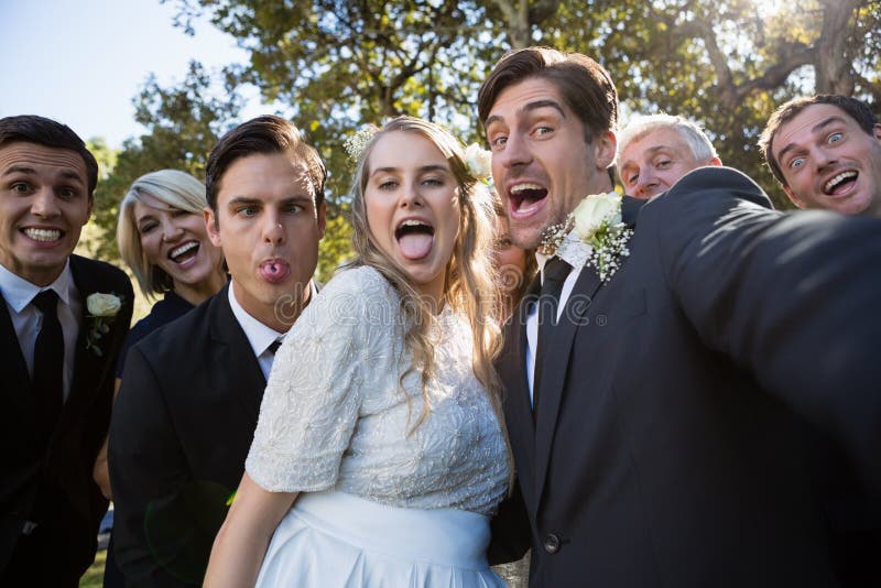 Happy Couple Posing with Guests during Wedding Stock Image - Image of ...