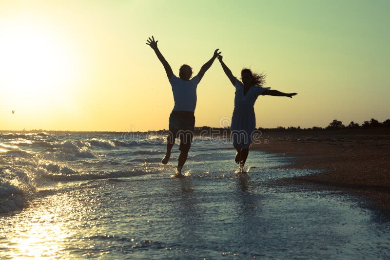 Happy Couple Running on the Beach Stock Image - Image of lovers ...