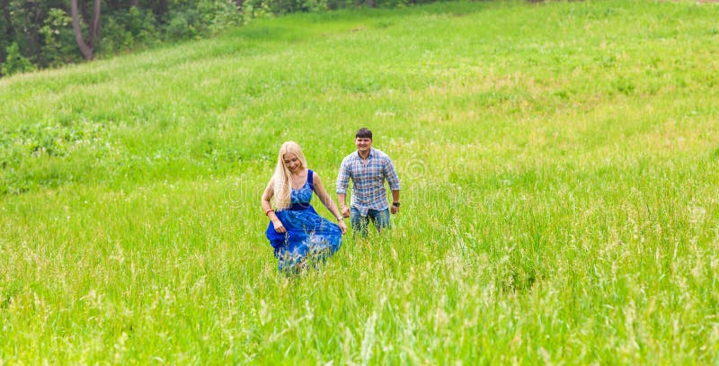 Happy Couple Running on a Meadow in Summer Nature Stock Photo - Image ...