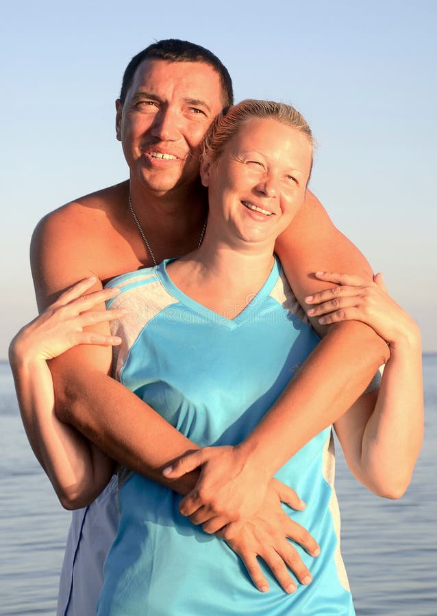 Happy couple in sea stock image. Image of aged, beach - 22989069