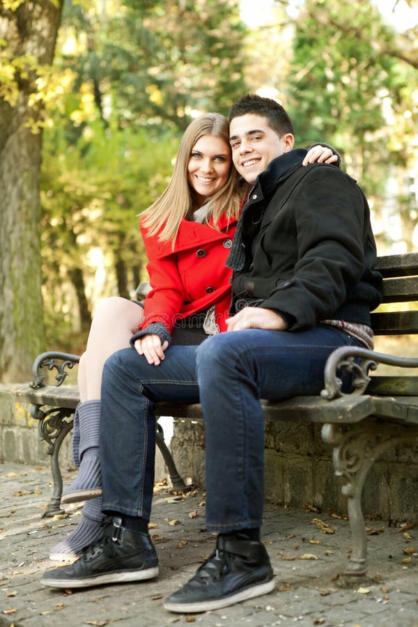 Happy Couple Sitting on Bench Stock Image - Image of fall, enjoy: 24783659