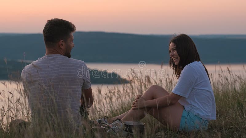 The Happy Couple Sitting on Mountain Top and Drinking Tea. Stock Photo ...