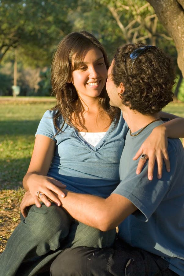Happy Couple Sitting In The Woods. Vertical Picture. Image: 5433565