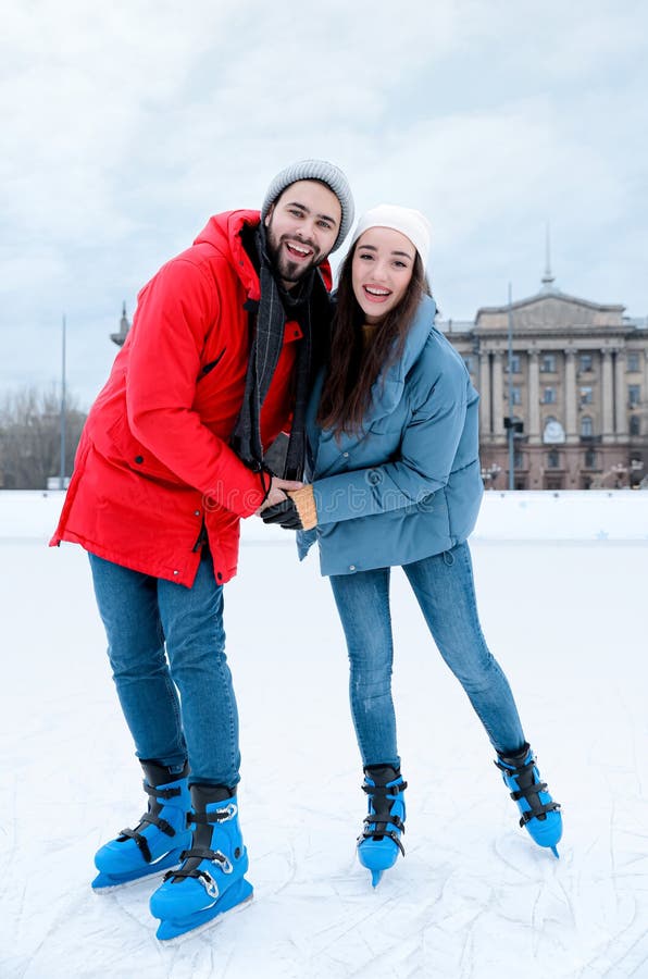 Happy Couple Skating Along Ice Rink Outdoors Stock Photo - Image of ...