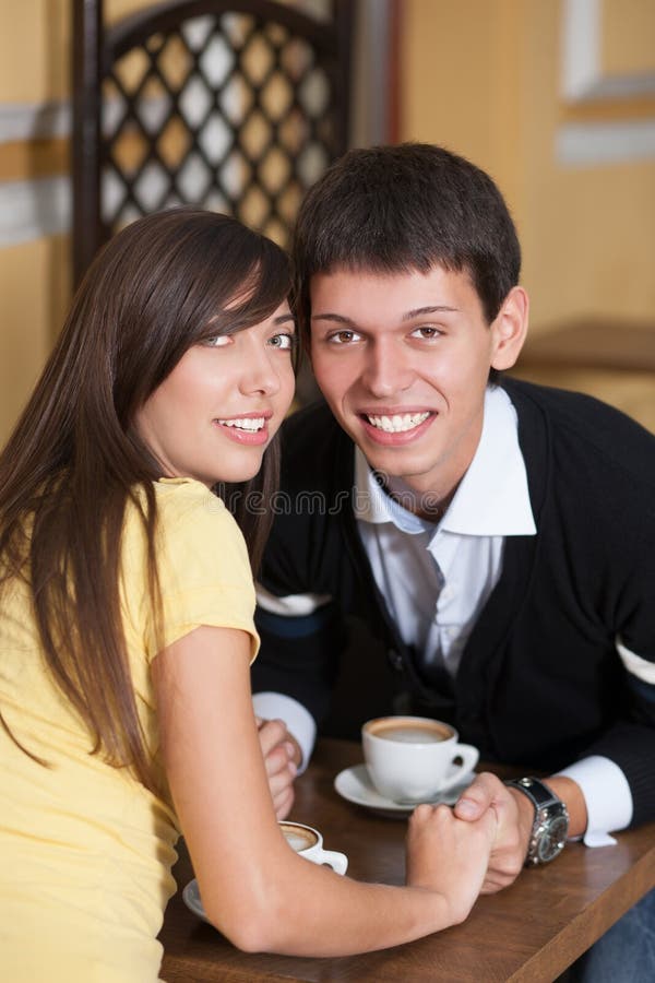 Happy Couple Smiling on Coffee Table. Stock Photo - Image of caucasian ...