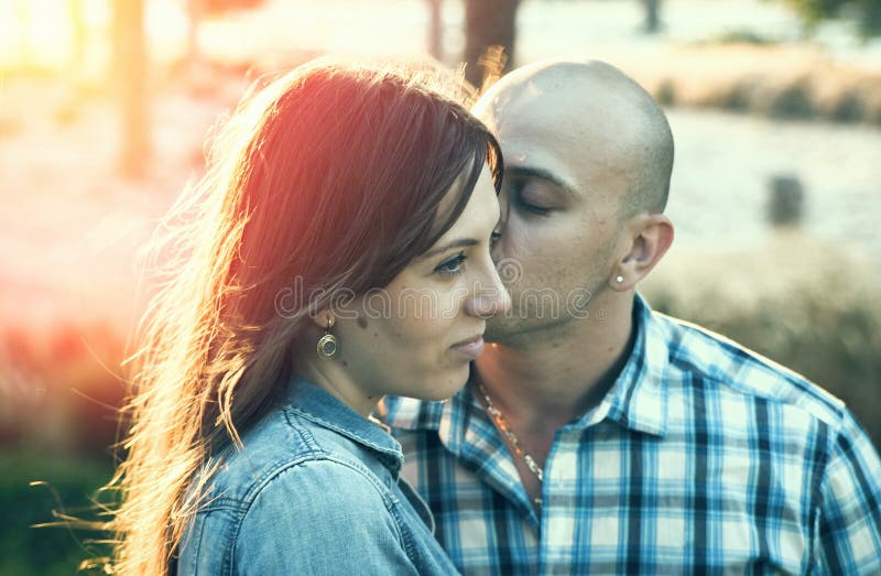 Happy couple in sunlight stock photo. Image of smiling - 115217128