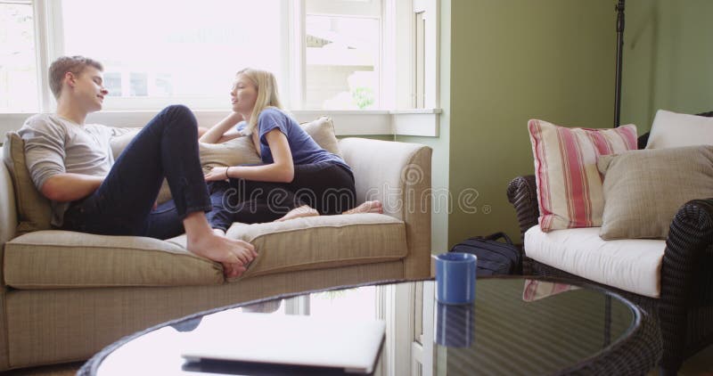 Happy Couple Talking on Couch Together Stock Footage - Video of ...