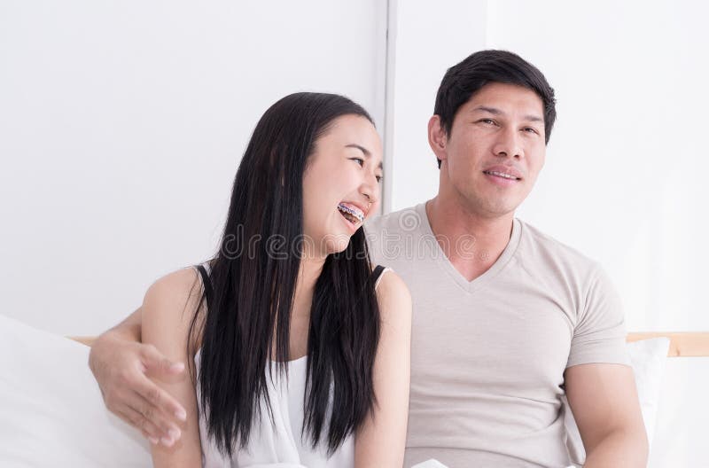 Happy Couple Talking Happily after Woke Up Stock Photo - Image of asian ...