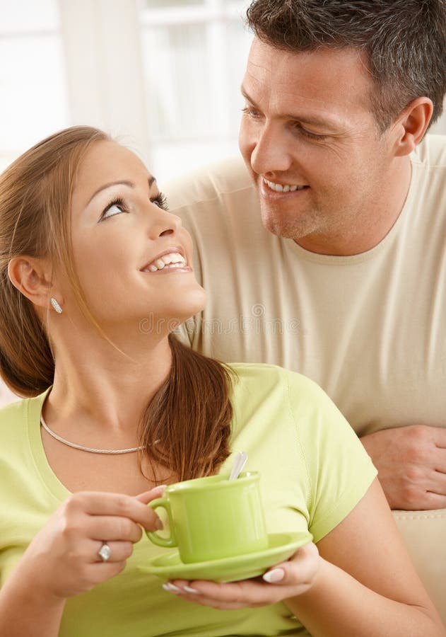 Happy couple with tea cup stock image. Image of enjoy - 13666525