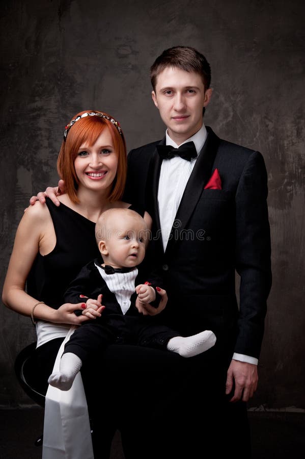 Happy Couple with Their Child Stock Photo - Image of adult, attractive ...