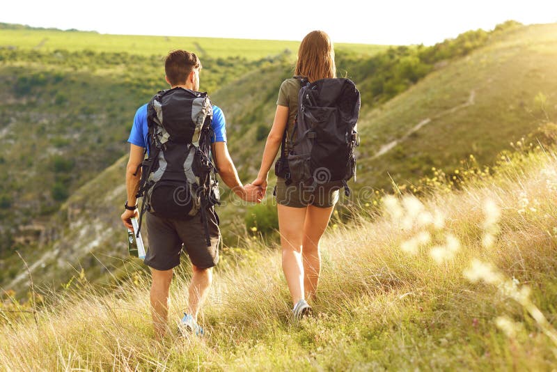 Happy Couple of Tourists on Nature. Back View. Stock Image - Image of ...