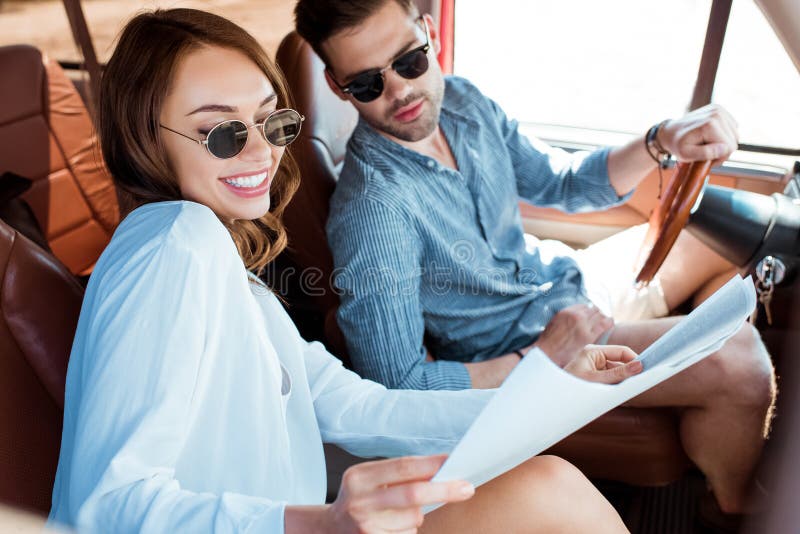 Happy Couple of Travelers Looking at Map Stock Image - Image of ...
