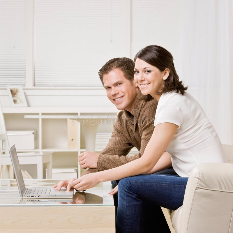 Couple with Laptop stock photo. Image of finding, news, paper - 84492