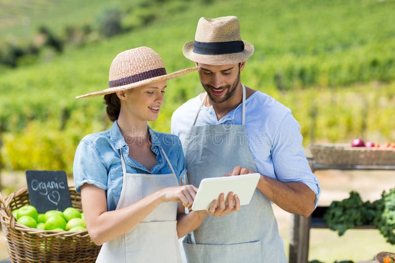 Happy Couple Using Digital Tablet at Farm Stock Photo - Image of ...