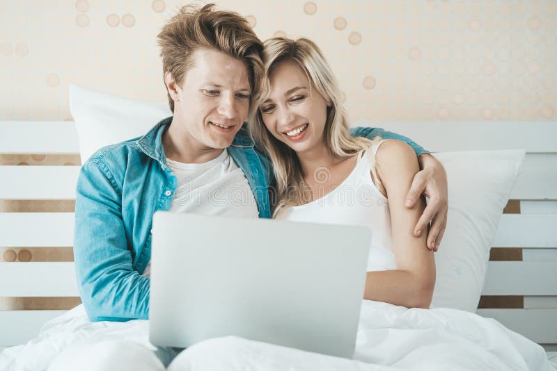 Happy Couple Using Laptop Computer Stock Photo - Image of couple ...